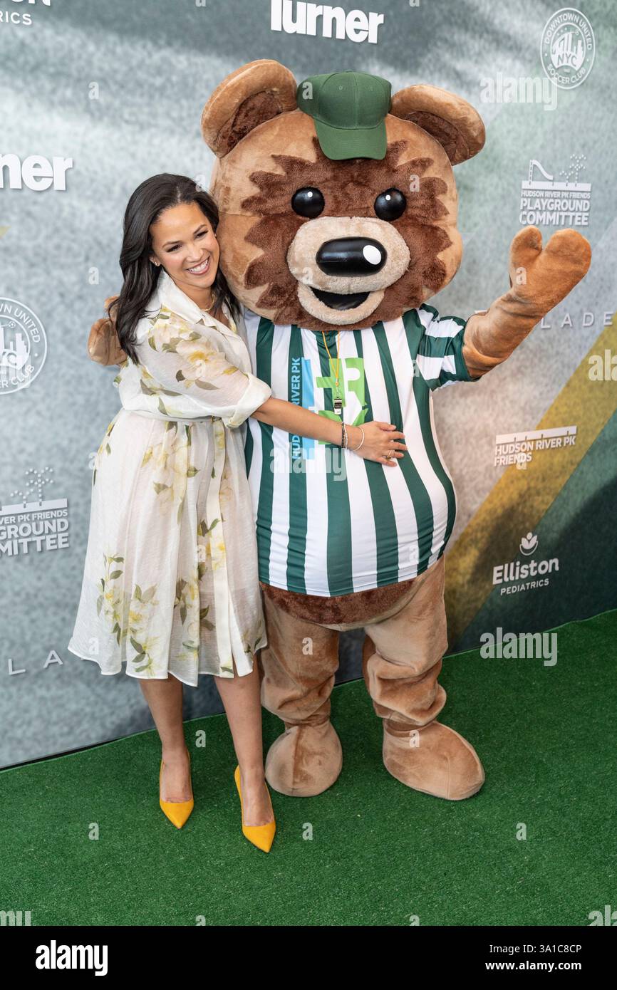 Laura Jarrett wearing dress by Zimmermann and park mascot attend Hudson ...