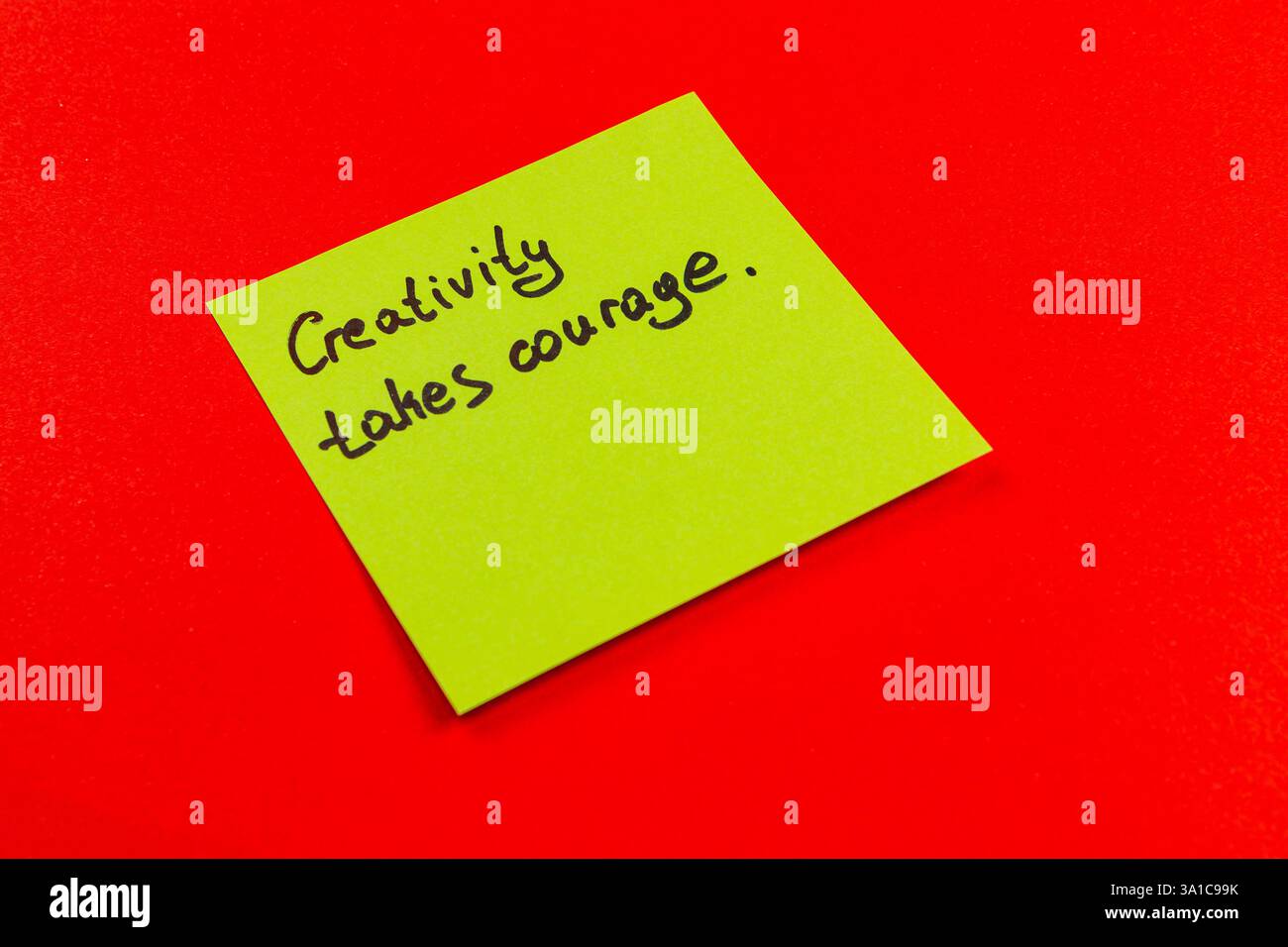 A vibrant green sticky note with the message Creativity takes courage ...