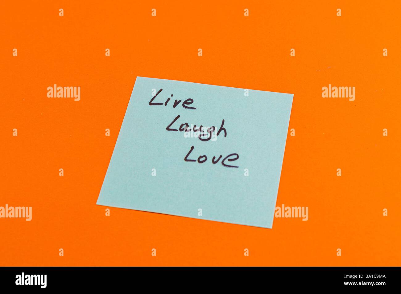 A light blue sticky note bears the handwritten words 'Live Laugh Love ...
