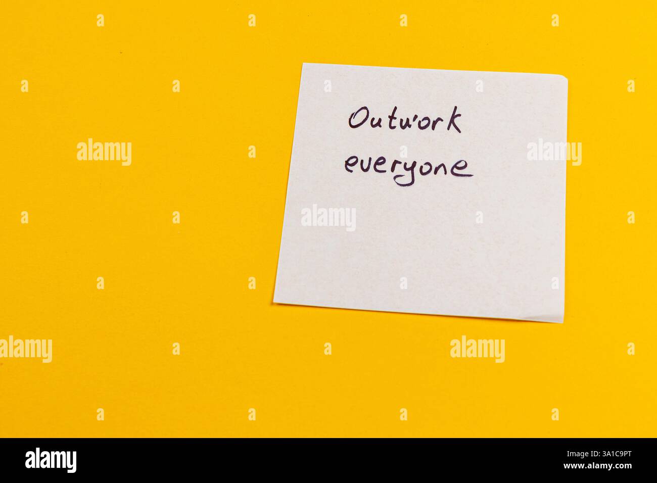 A handwritten note on a yellow background encourages teamwork and ...