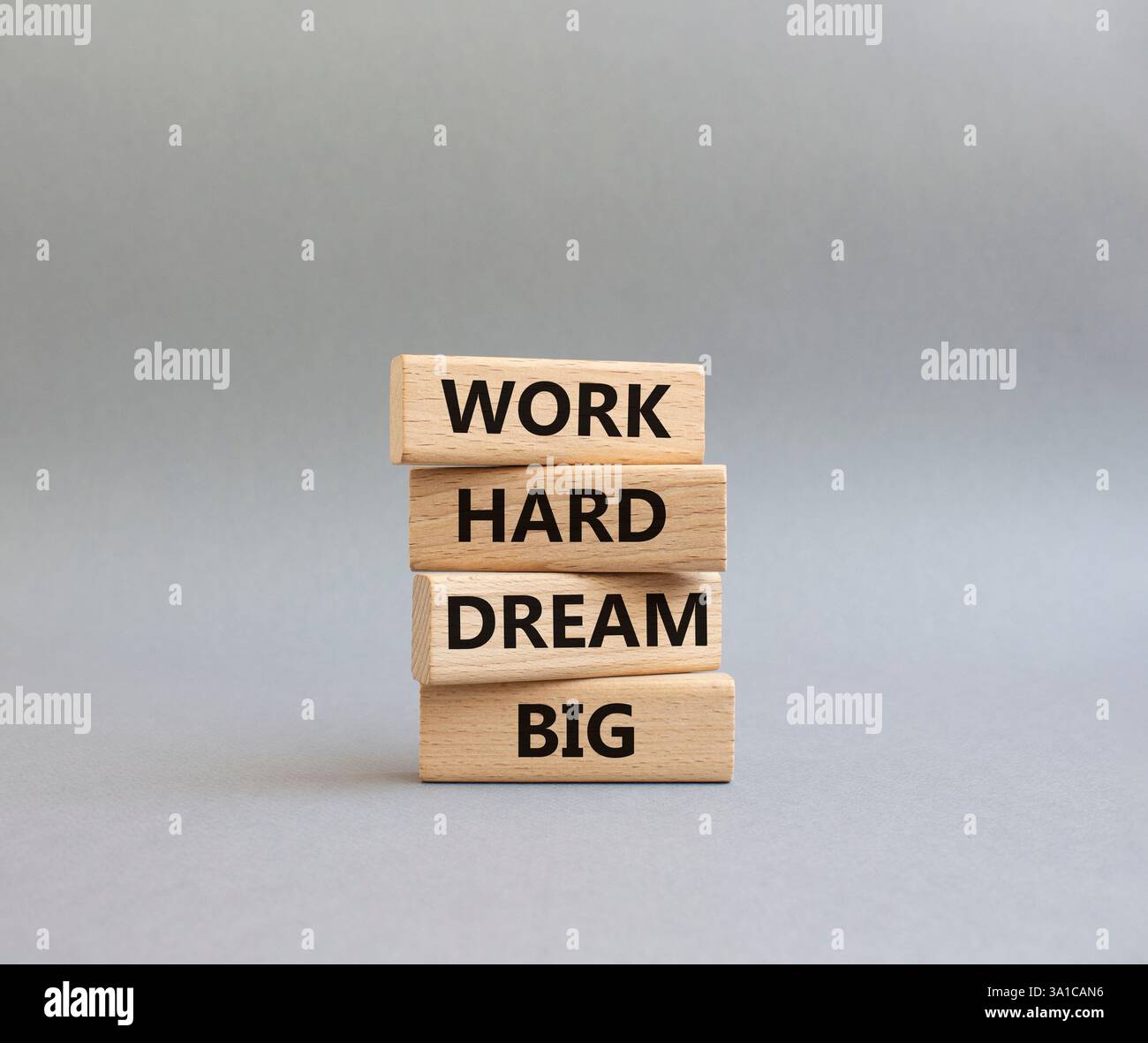 Work and dream symbol. Wooden blocks with words 'Work Hard Dream Big ...