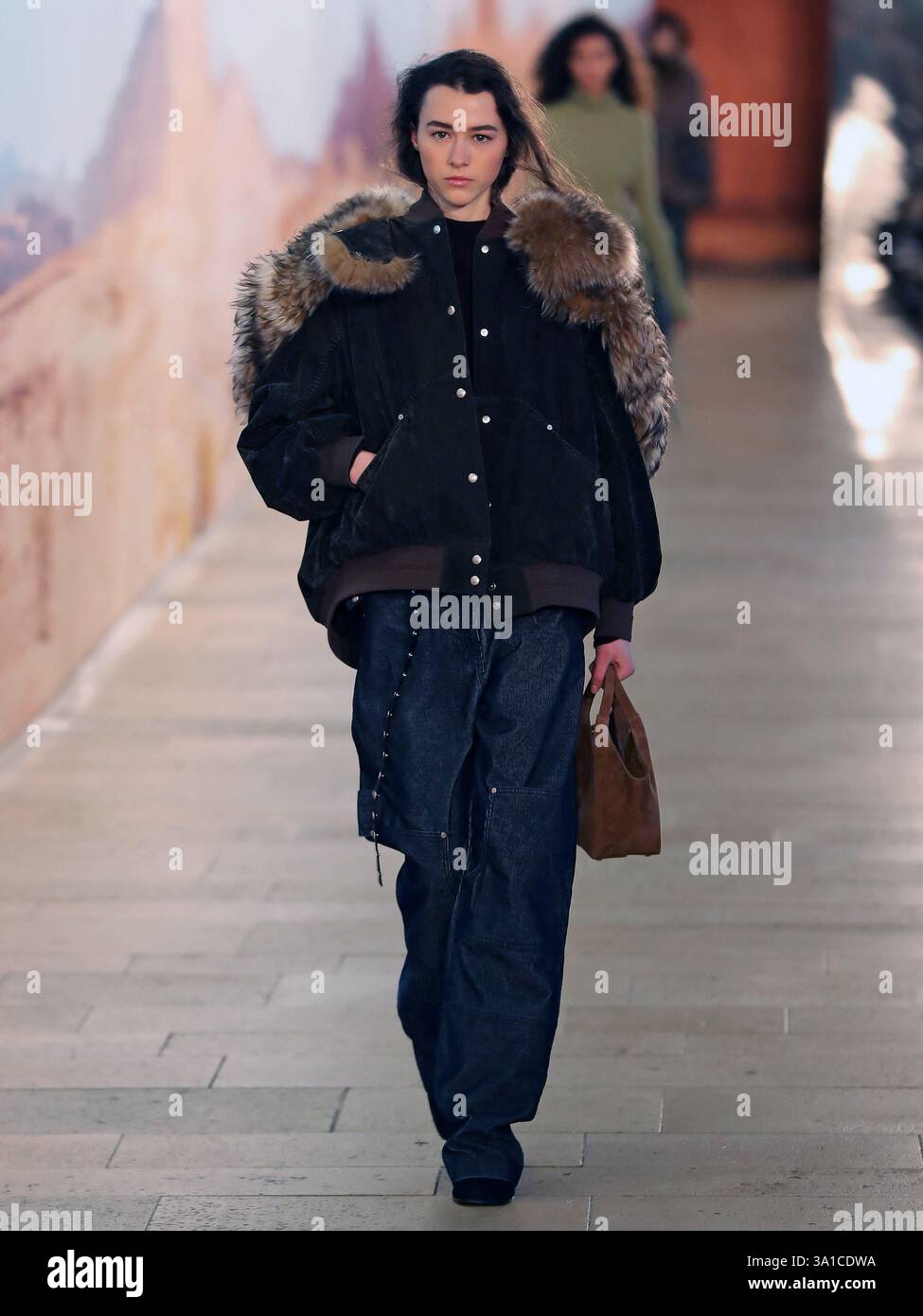 A model walks the runway during the Time Womenswear Fall/Winter 2025 ...