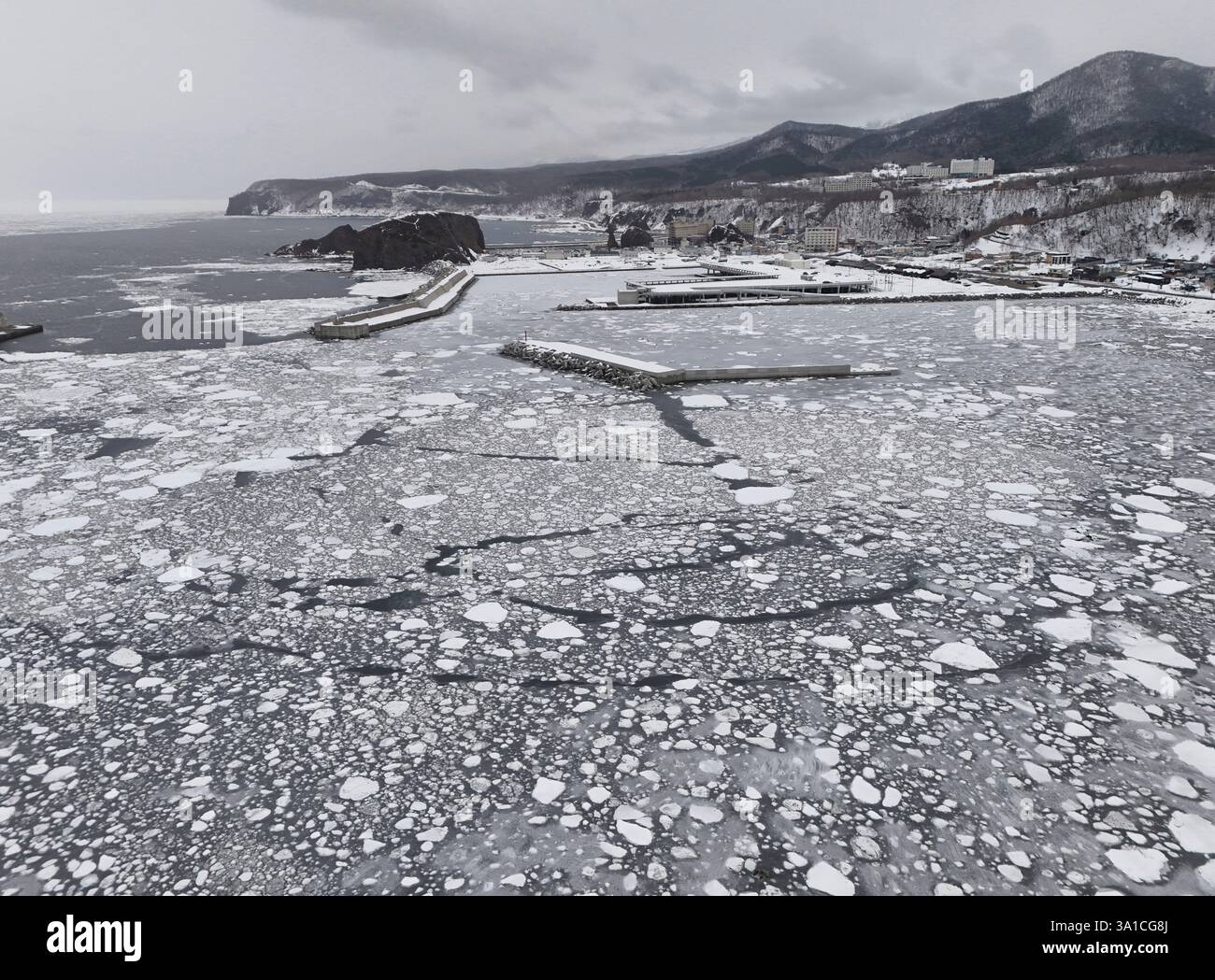 An aerial photo shows drift ice rushes to Shiretoko Peninsula in Shari ...