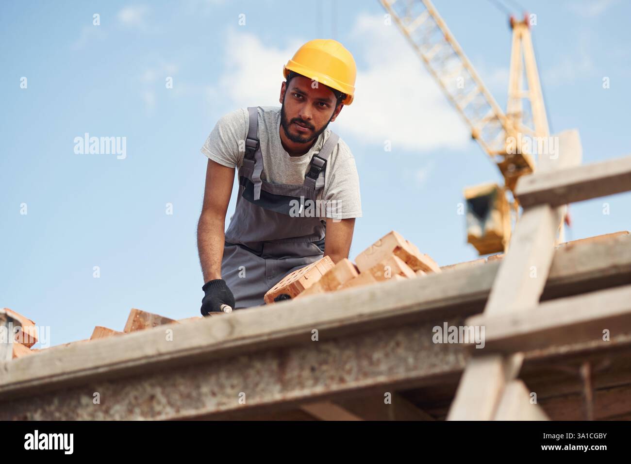 Focused on work. Handsome Indian man is on the construction site Stock ...