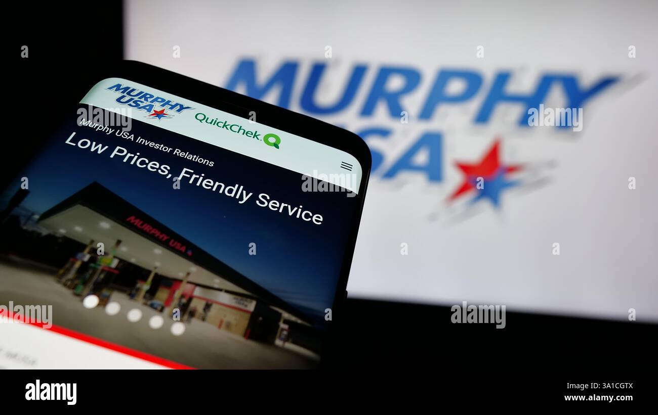 In this photo illustration, a smartphone with the website of US gas station company Murphy USA ...