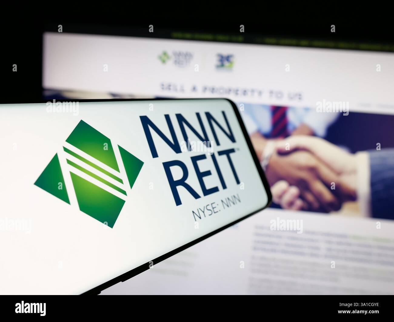 In this photo illustration, a mobile phone with the logo of American ...