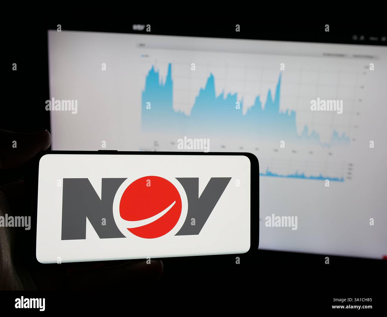 In this photo illustration, a person is holding a mobile phone with the ...