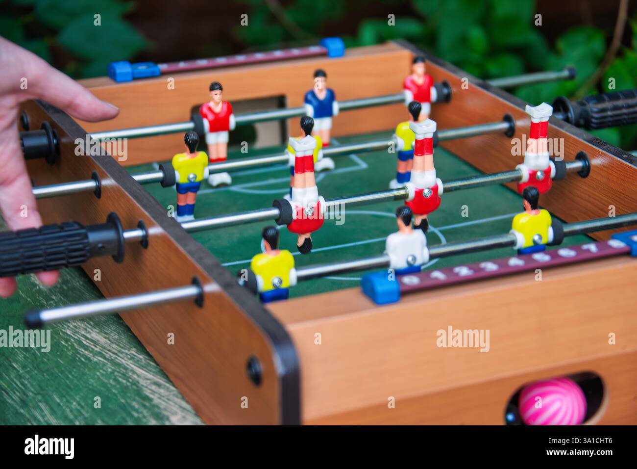Foosball, Table football, also known as table soccer, with blue ...