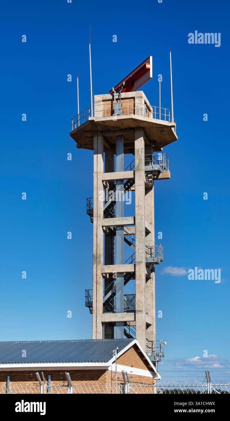 military radar in top of tower against the blue sky Stock Photo - Alamy