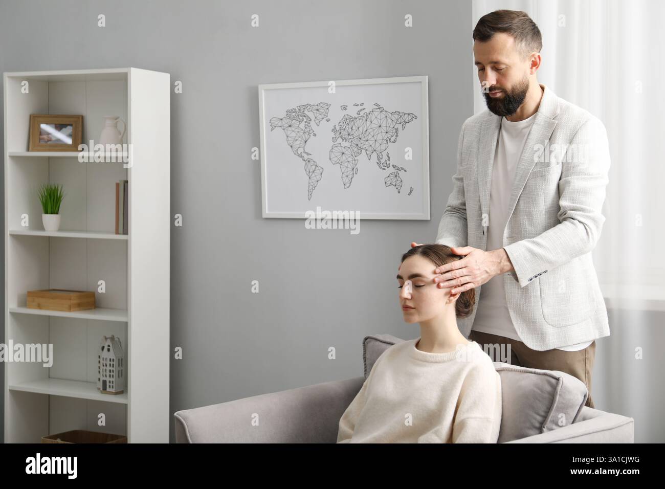 Psychologist working with patient during hypnosis session indoors Stock ...