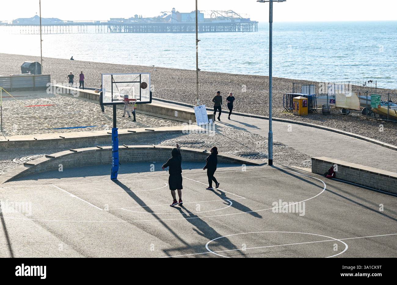 Brighton UK 8th March 2025 - Basketball players enjoy the sunshine on ...