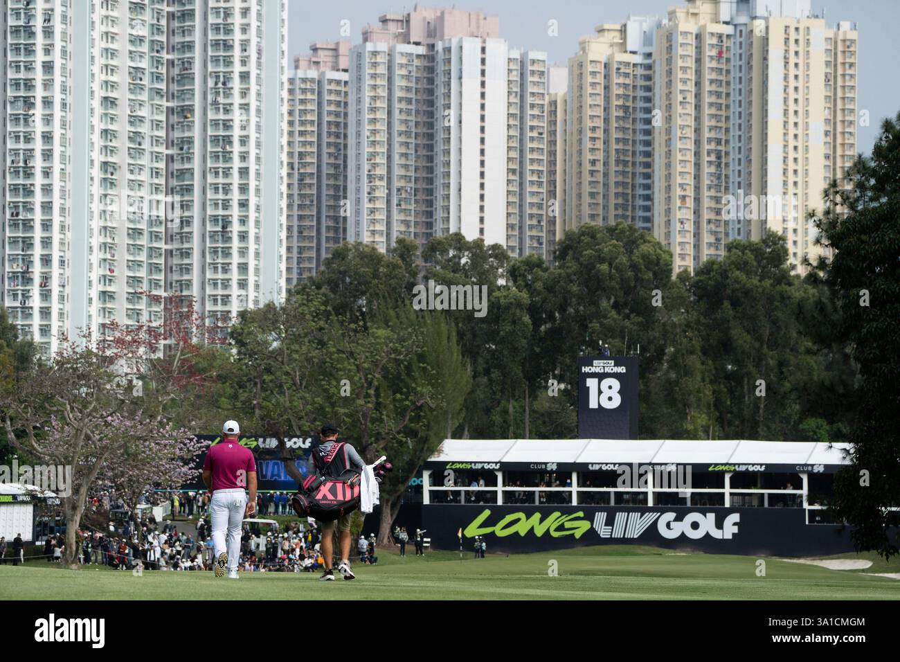 Tyrrell Hatton of Legion XIII and caddie, Hugo Dobson, walk towards the ...