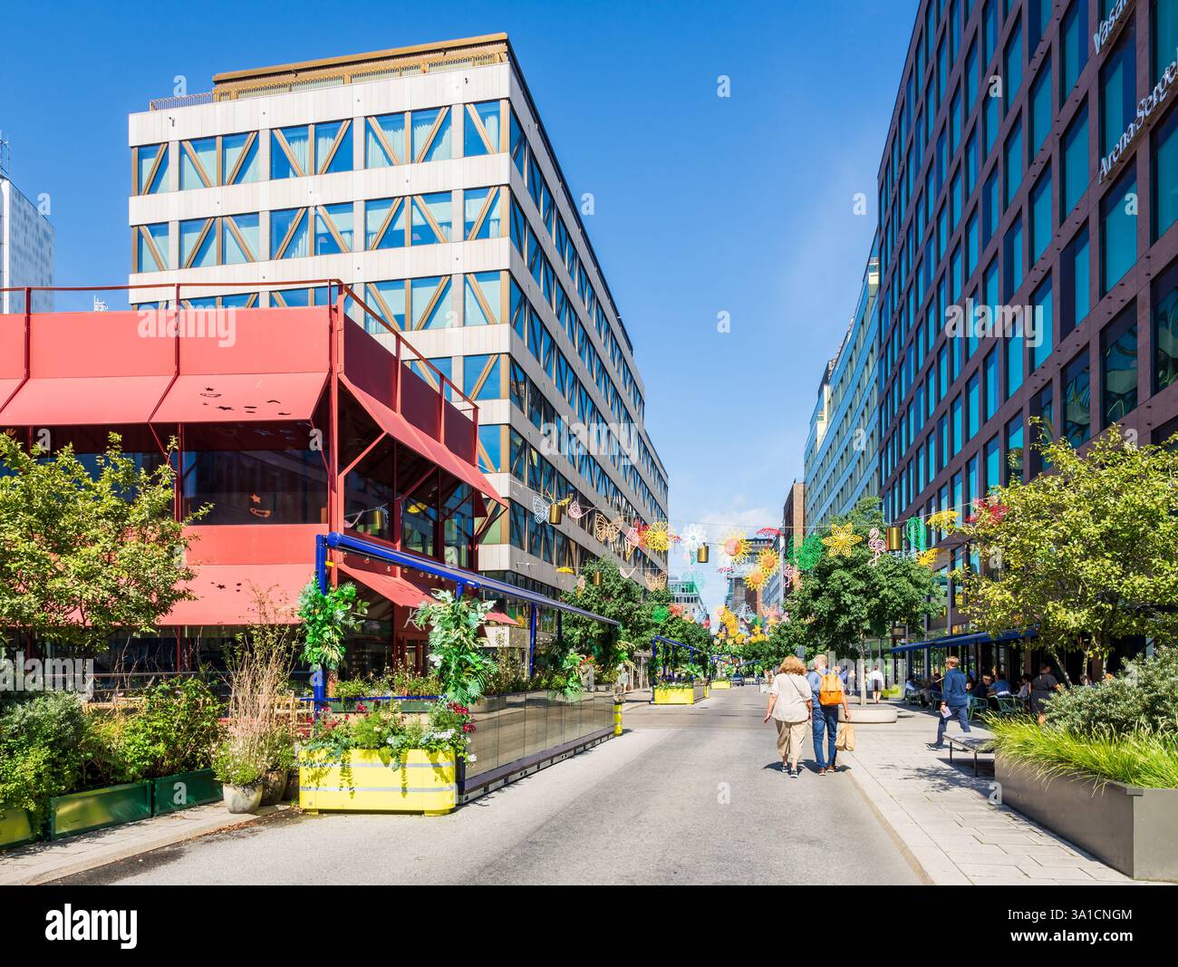 People stroll past the Röda Huset restaurant in Malmskillnadsgatan in ...