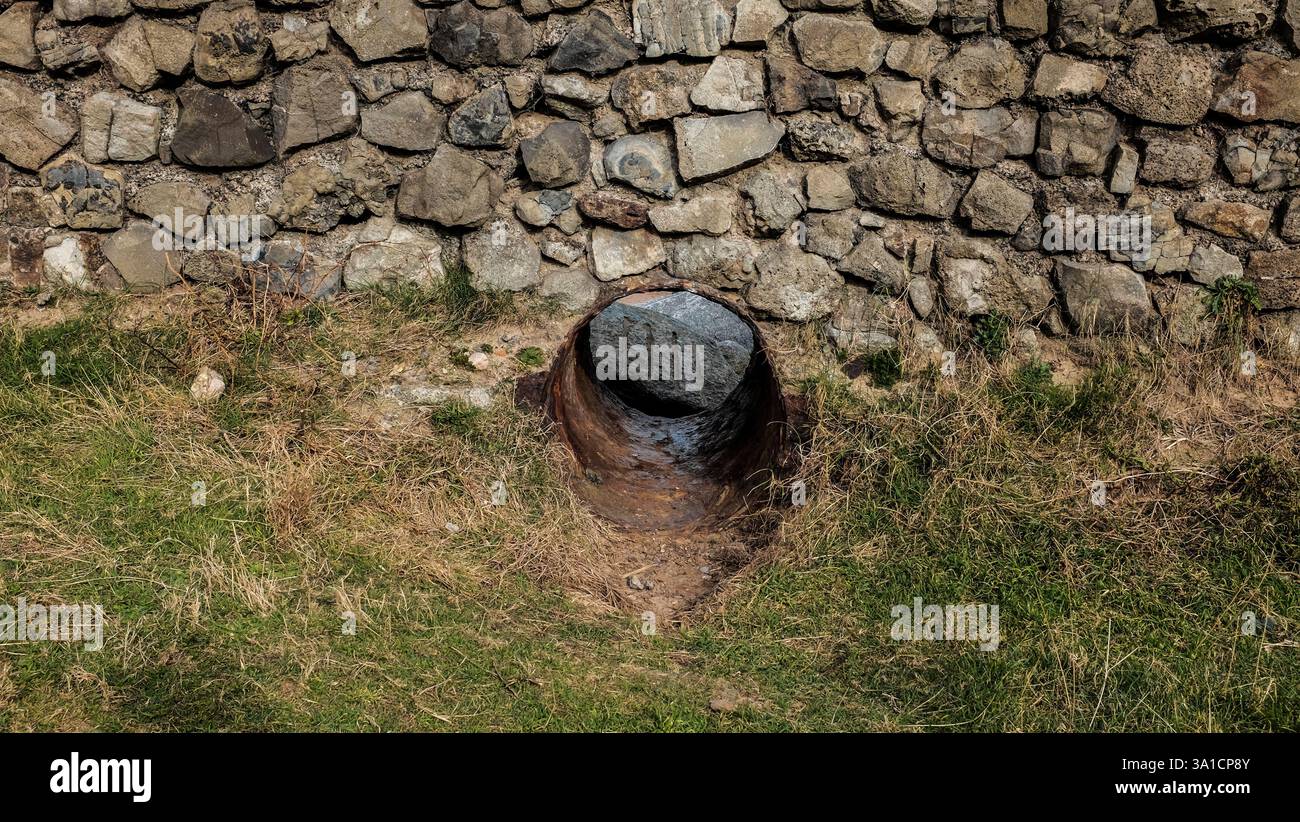 Outflow pipe through a stone wall leading to beach at Skinningrove ...