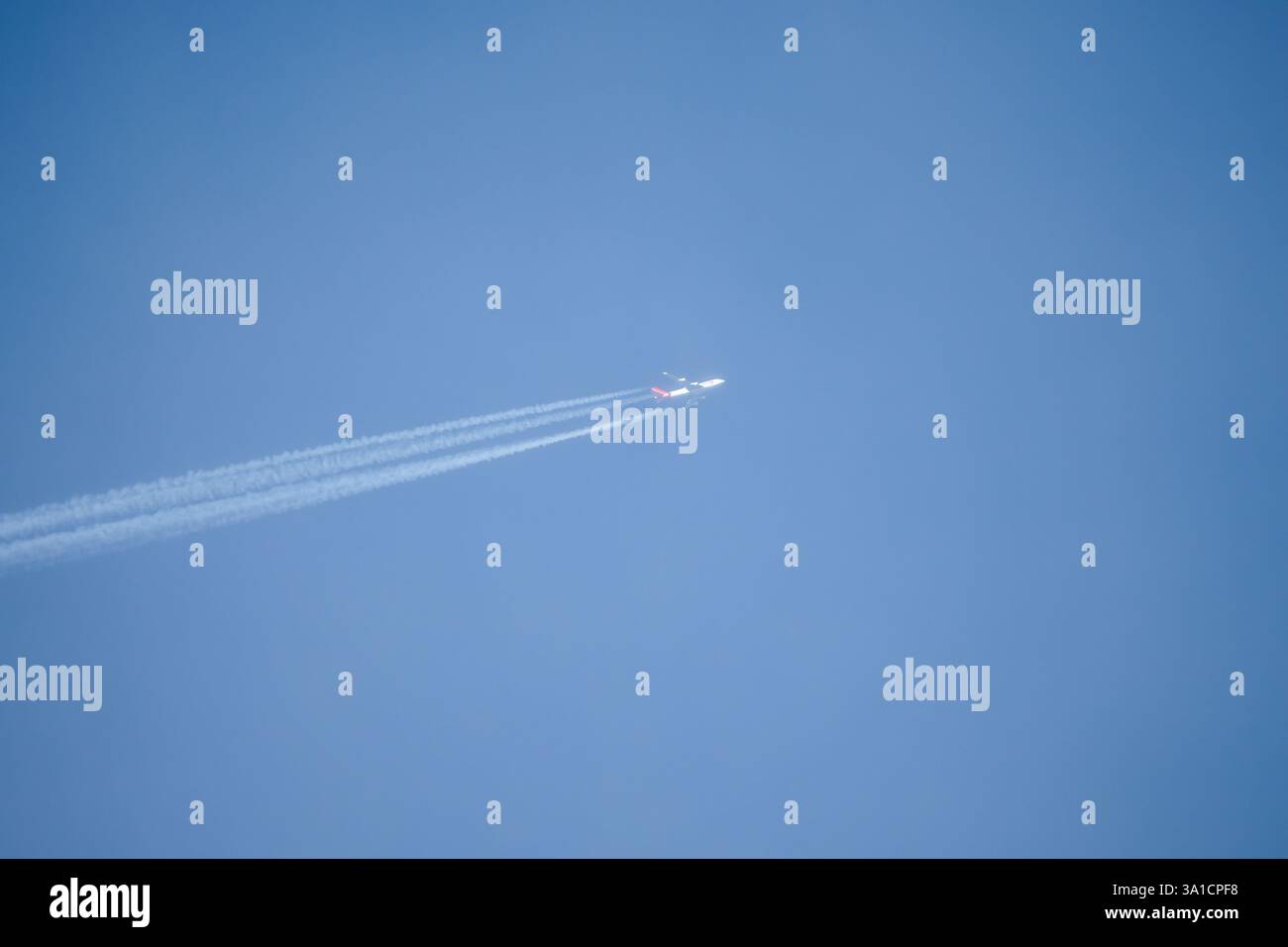 high altitude quad engine contrails (jet airplane vapour trails) across ...