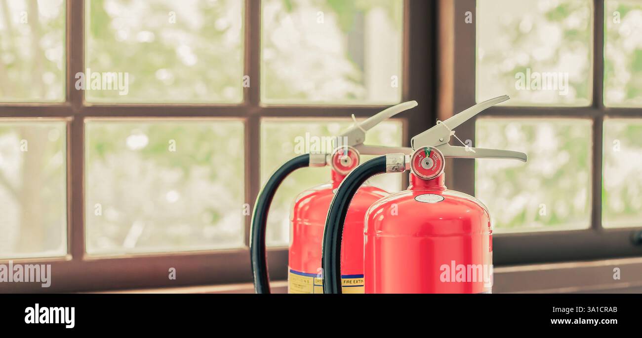 The red fire extinguisher is ready for use in case of an indoor fire ...