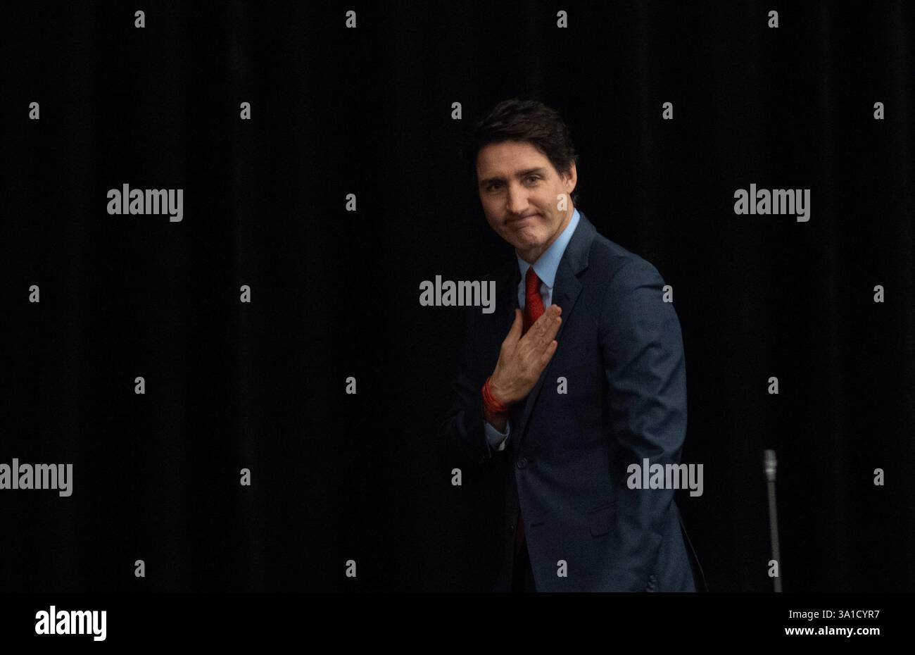 Prime Minister Justin Trudeau leaves the stage after speaking at the ...
