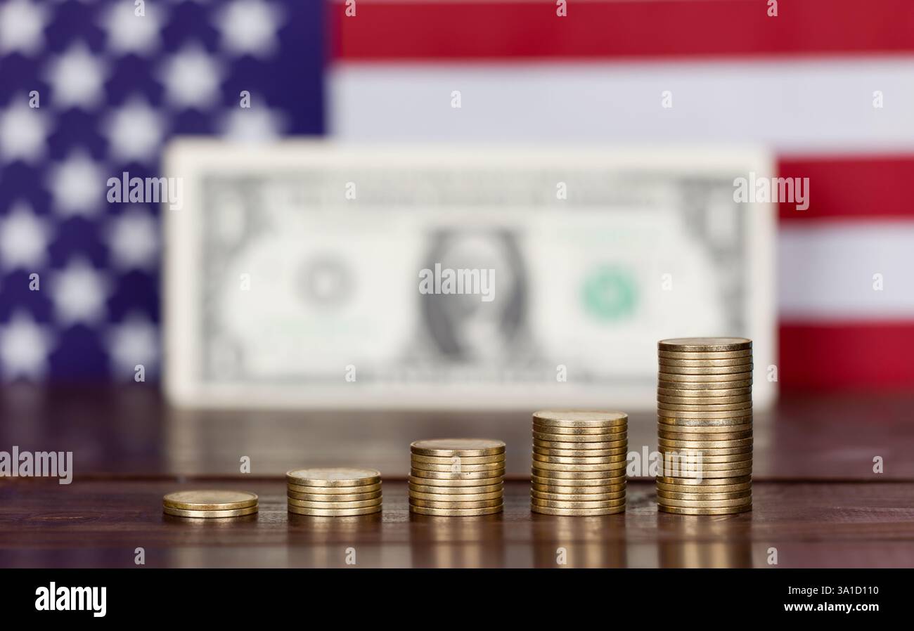 Coins with US dollar banknote and flag, tariff and inflation rate ...