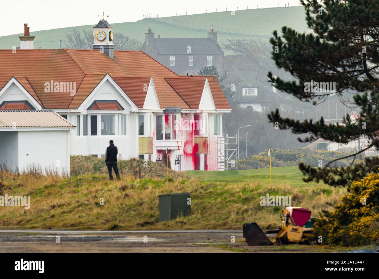 Ayr, UK. 08 MAR, 2025. Man looks on Towards club house covered in red ...