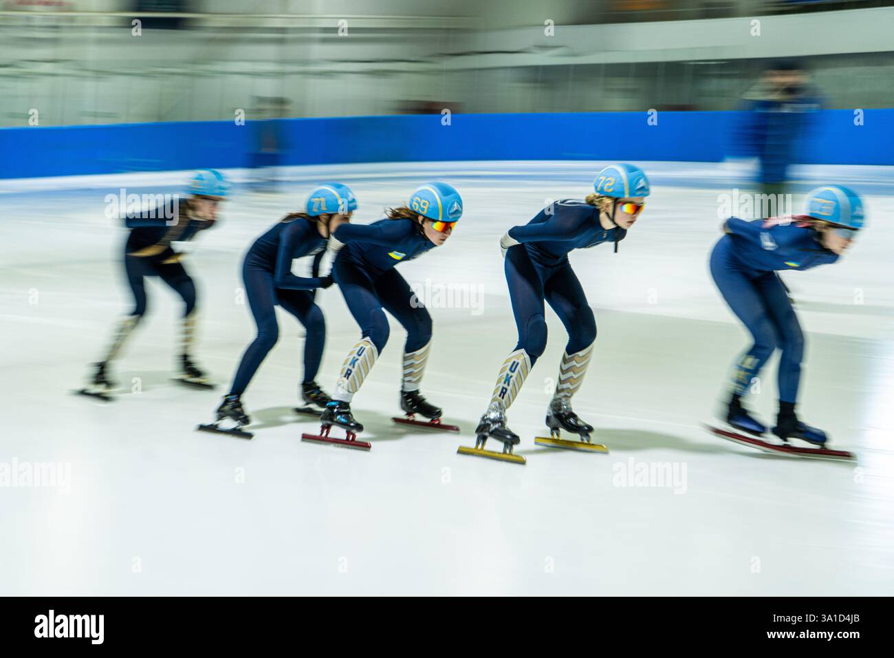 Ice Speed Skating. Children on the ice arena. Skates Sport child ...