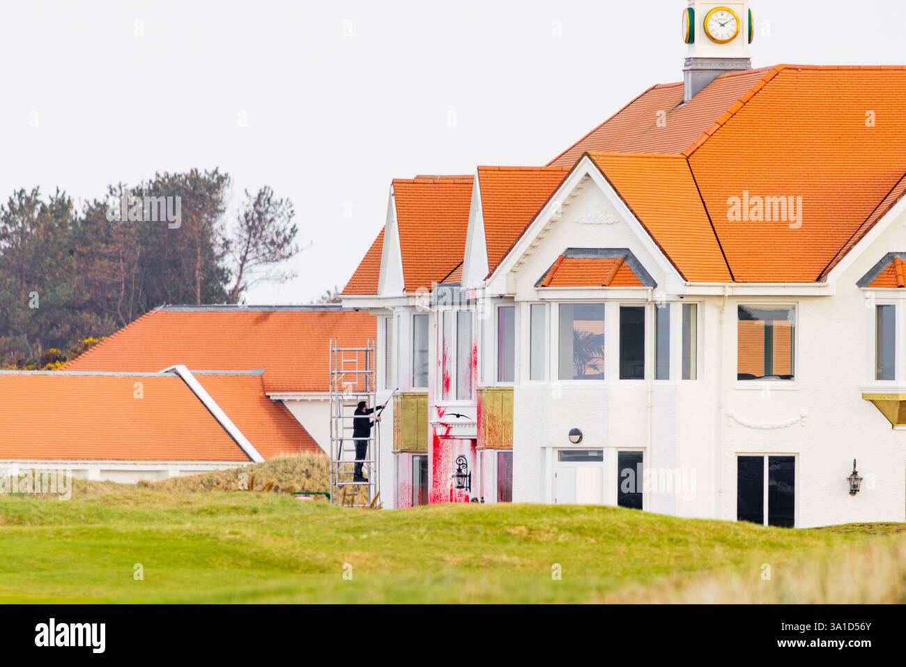 Ayr, UK. 08 MAR, 2025. Worker cleans club house covered in red paint as ...