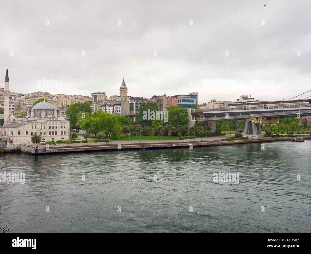 View of Istanbul's waterfront with historic buildings, modern ...