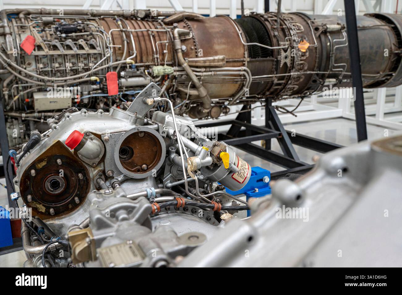 A large engine is sitting in a hangar with other engines Stock Photo ...