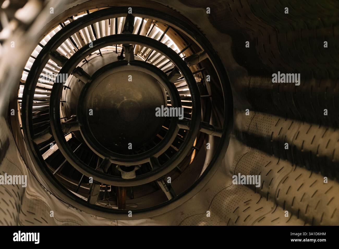 A large, circular object with a black and silver color scheme Stock ...