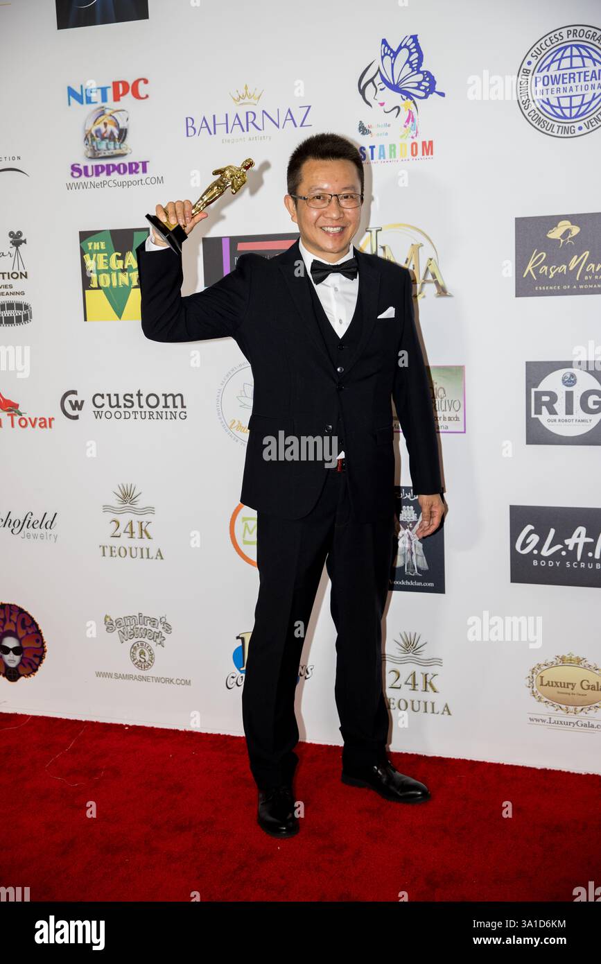 Artist Wenkang Xue with his award with his award at the Luxury Gala ...