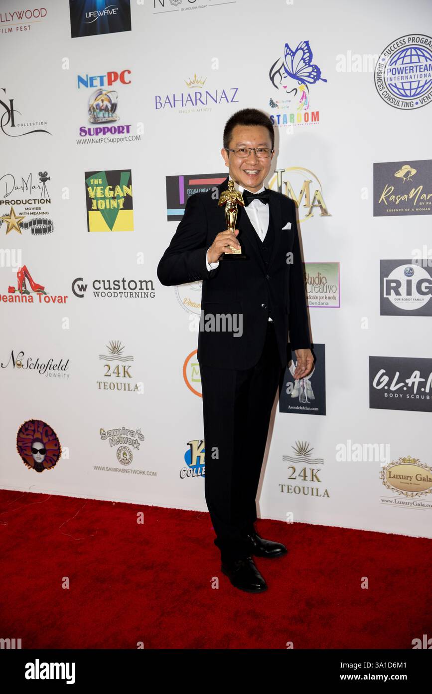 Artist Wenkang Xue with his award with his award at the Luxury Gala ...