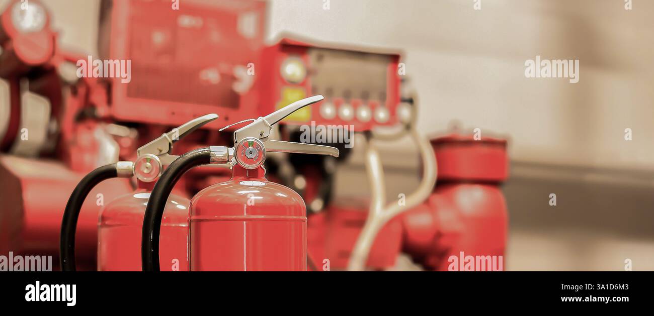 The red fire extinguisher is ready for use in case of an indoor fire ...