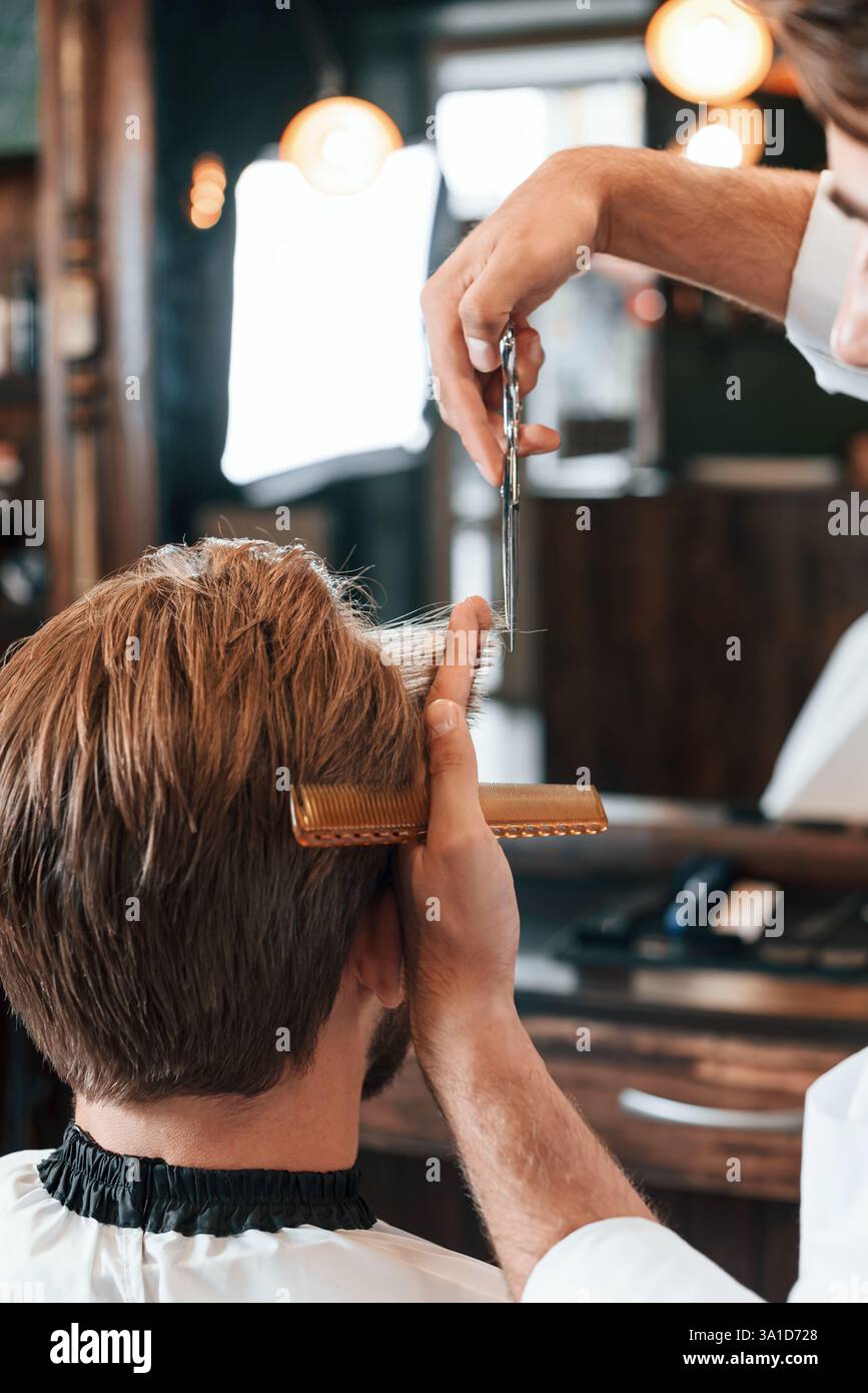 Getting haircut. Man is visiting modern barber shop. Modern style Stock ...