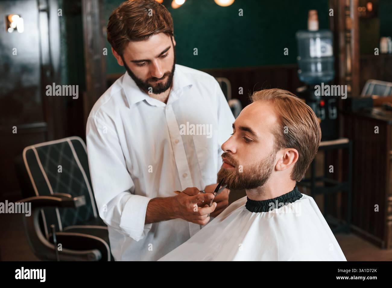 Using scissors. Man is visiting modern barber shop. Modern style Stock ...