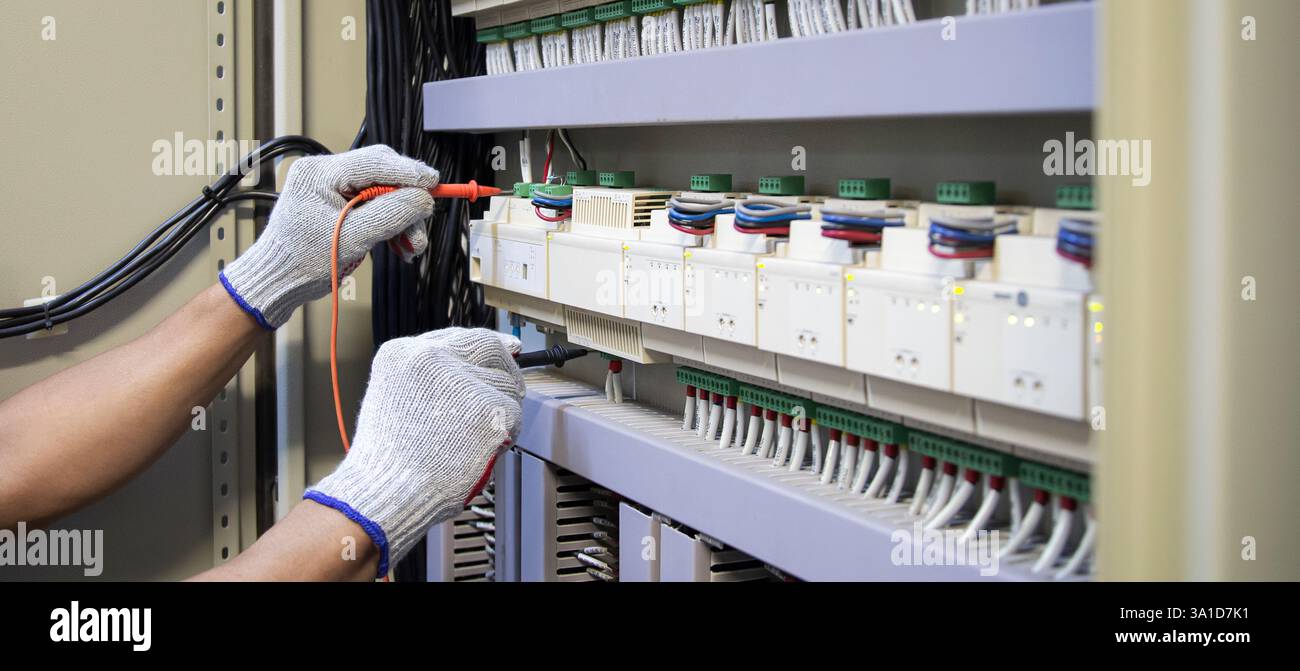 Technicians use multimeter to test or diagnose electrical control ...