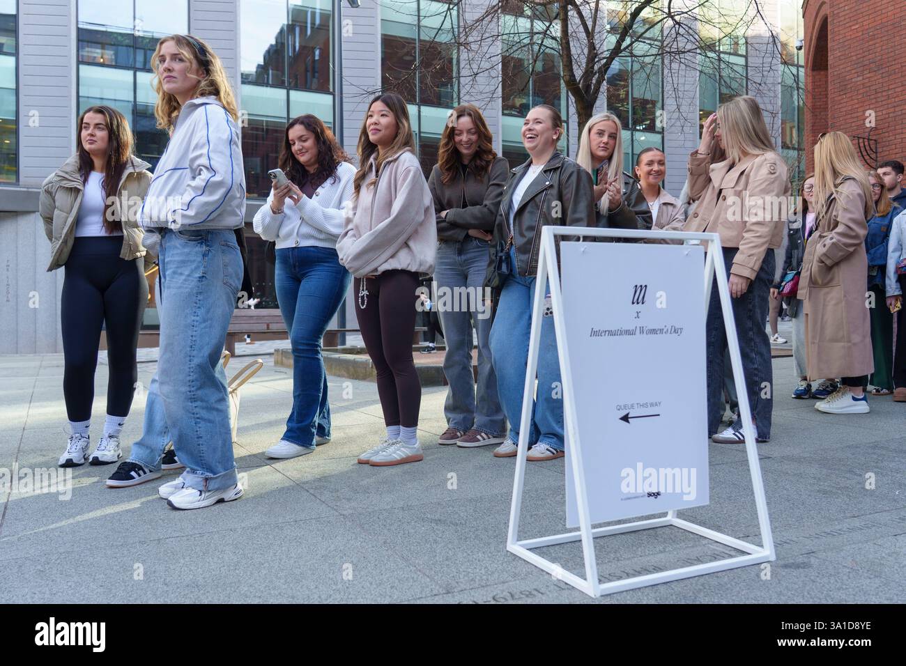 EDITORIAL USE ONLY Members of the public queue as influencer Molly-Mae ...