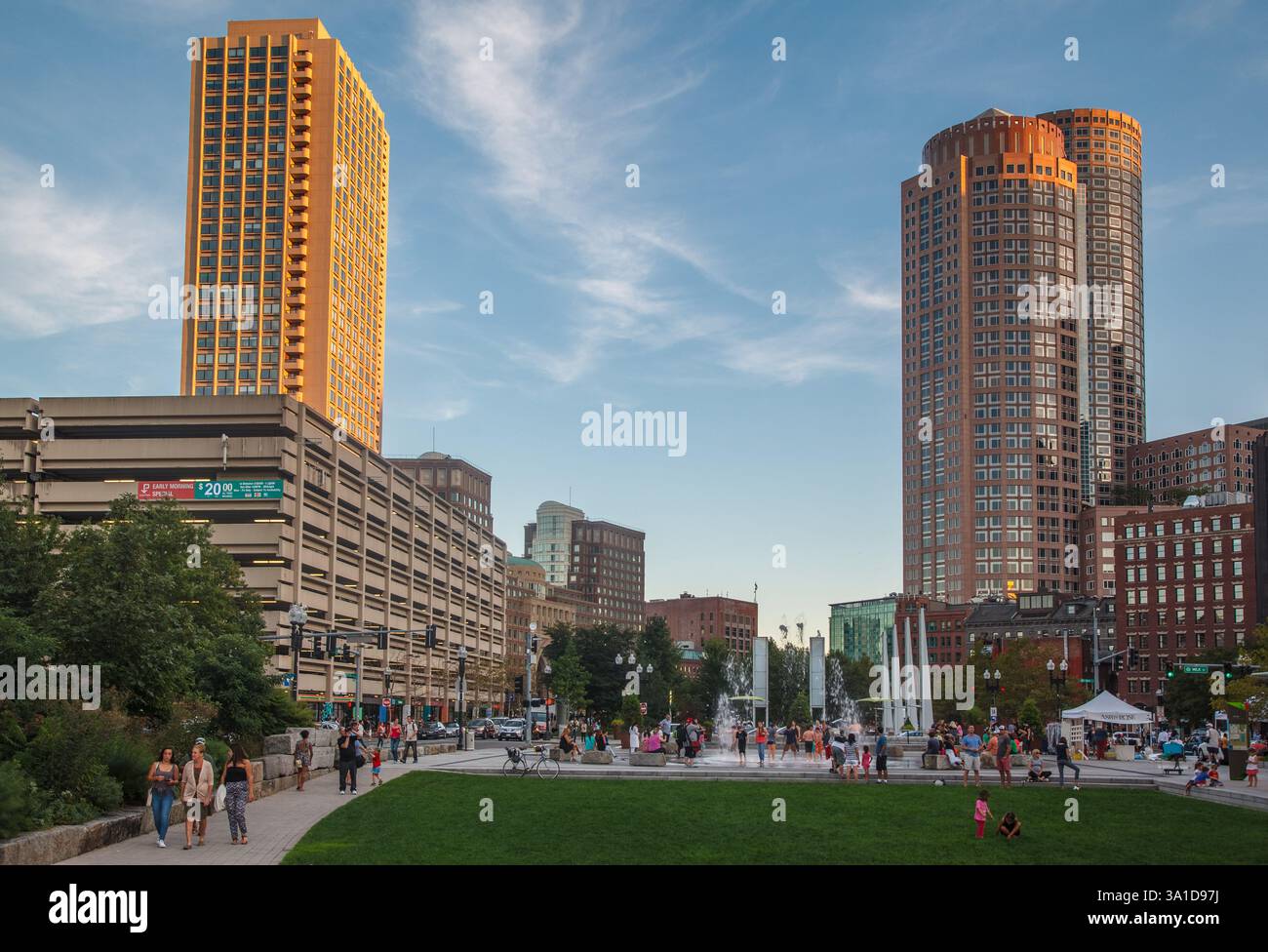 People enjoyoing the rings fountain, One International place and the ...