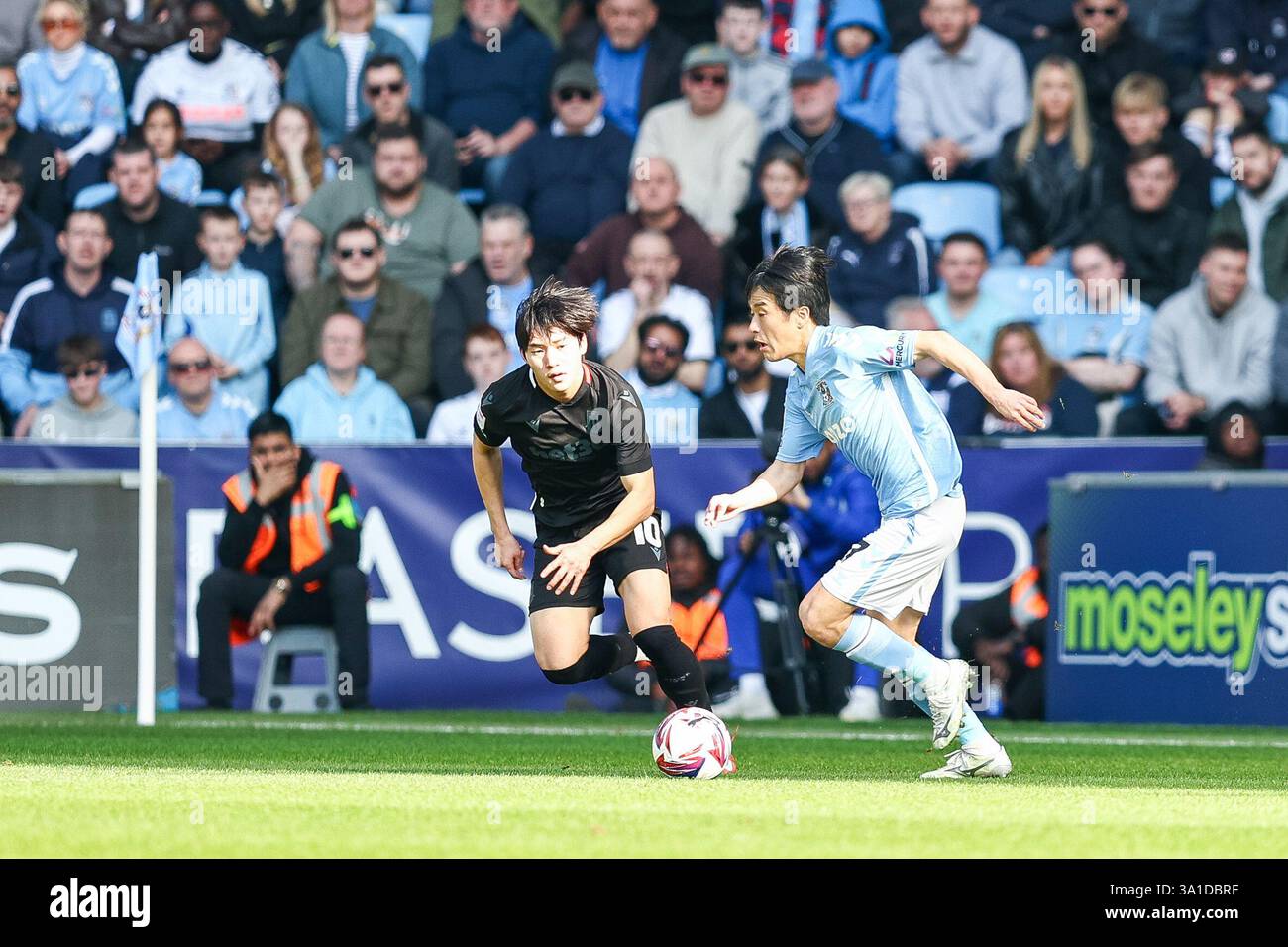 #10, Bae Jun-Ho of Stoke City moves to intercept as #7, Tatsuhiro ...