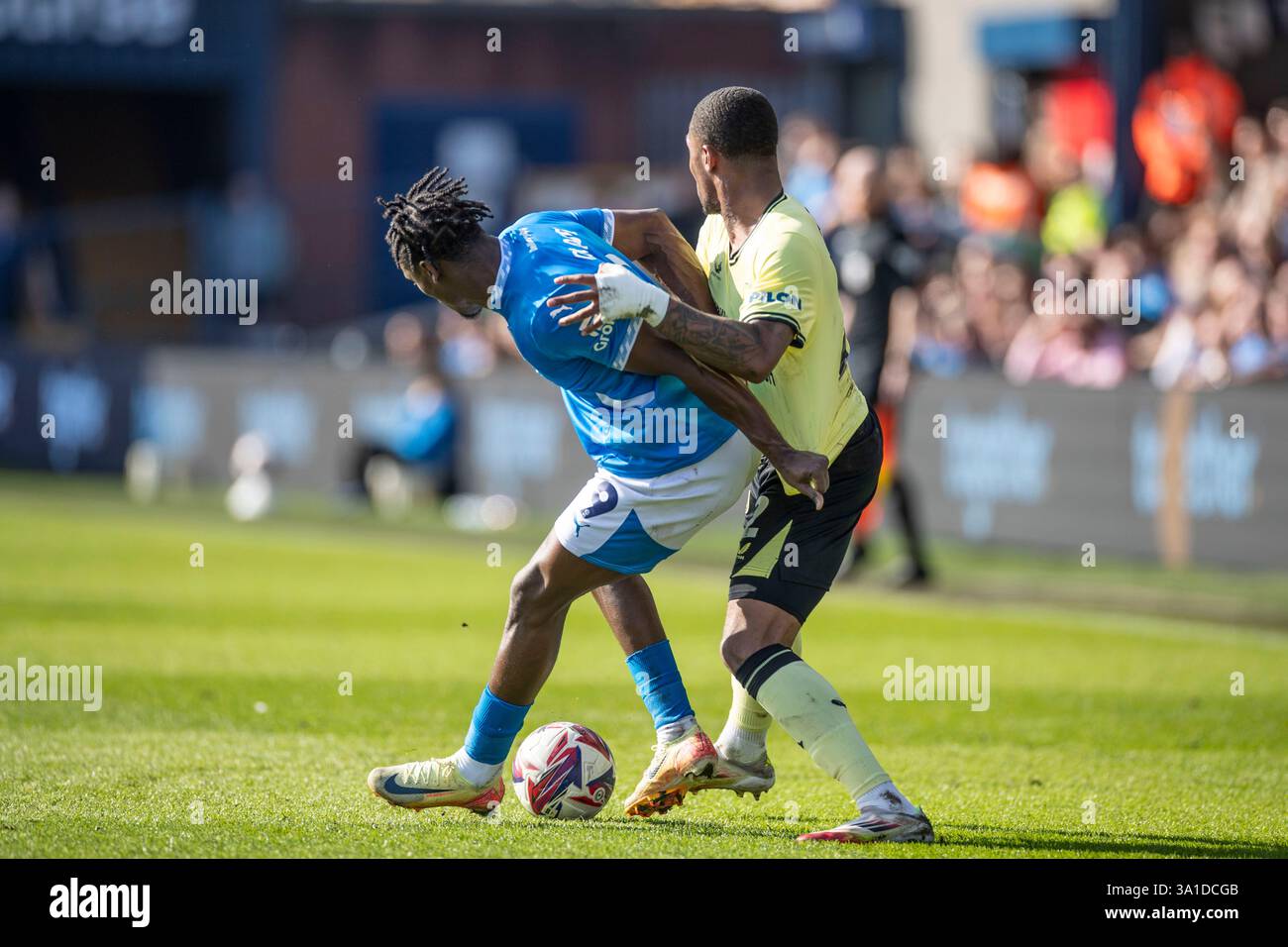 Tanto Olaofe #9 of Stockport County F.C.goes past the opponent during ...
