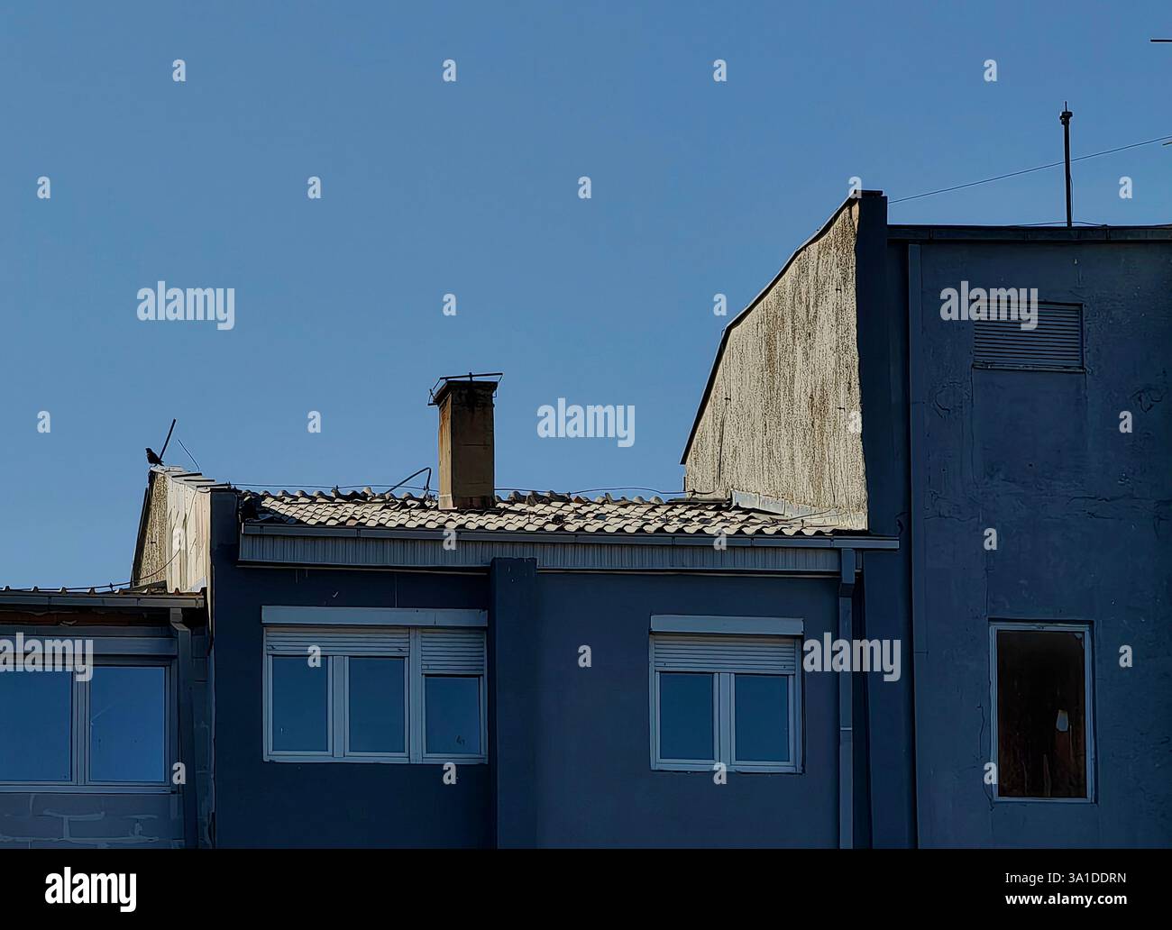 Sunlit Chimney & Shaded Windows – Rooftop Contrast Stock Photo - Alamy