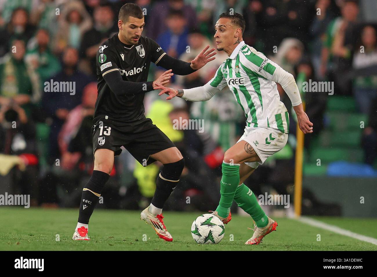 Antony Dos Santos of Real Betis and Joao Teixeira Mendes of Vitoria ...