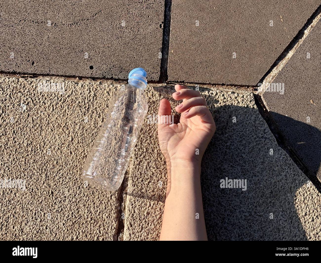 A young woman collapses from heat and dehydration, losing consciousness ...