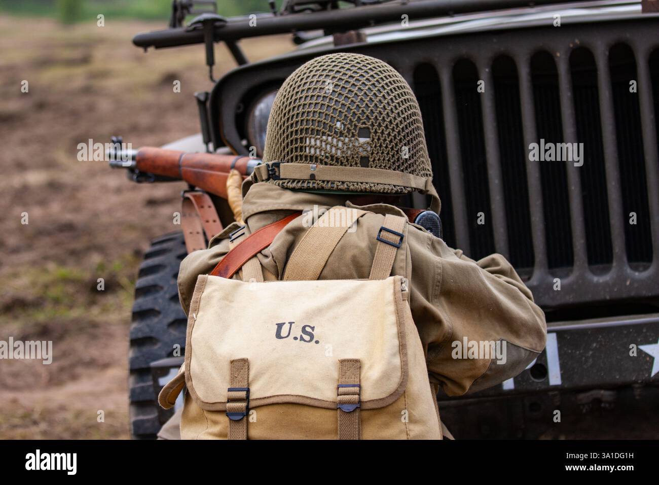Historical reconstruction. American paratrooper from World War II shoot ...