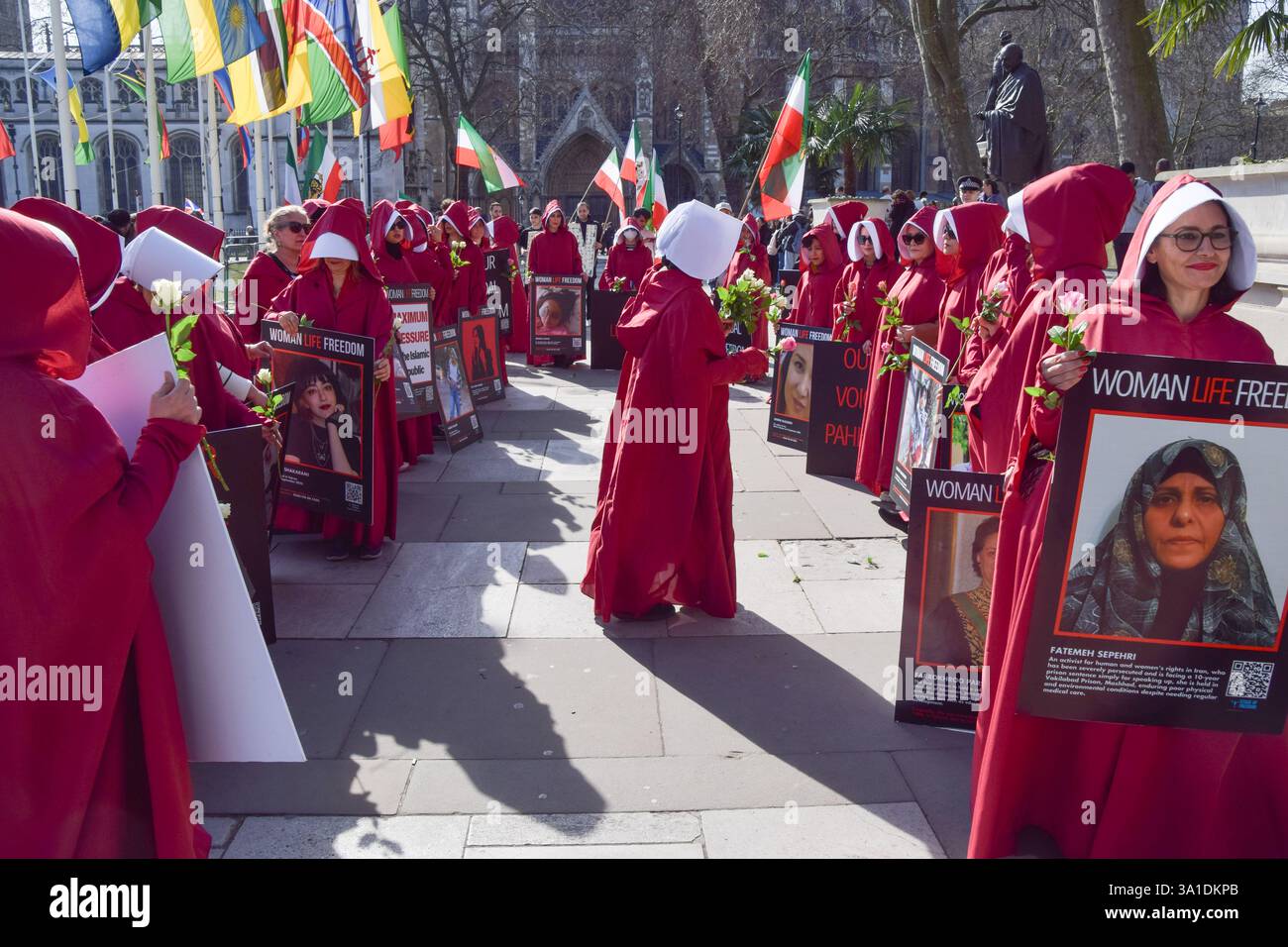 London, UK. 8th March 2025. Women wearing The Handmaid's Tale costumes ...