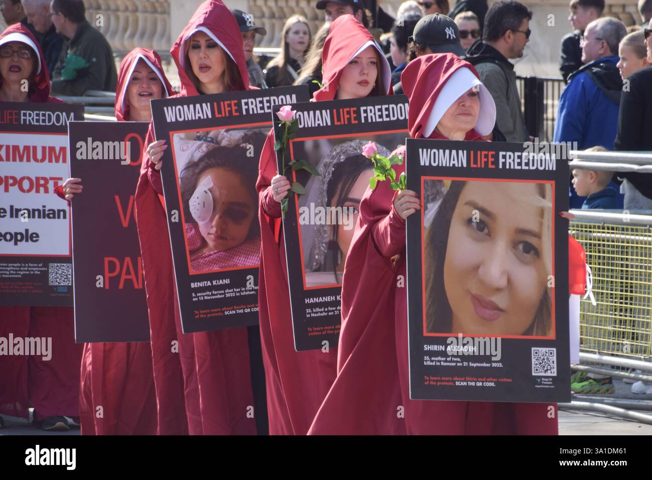 London, UK. 8th March 2025. Women wearing The Handmaid's Tale costumes ...