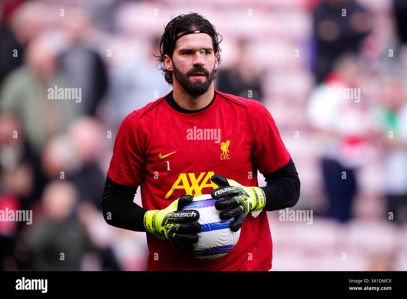 Liverpool goalkeeper Alisson Becker warming up before the Premier ...