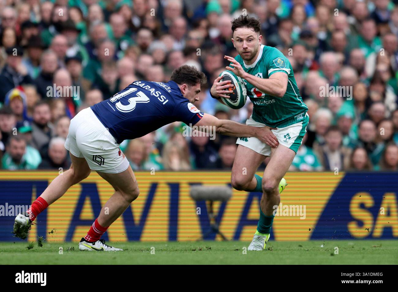 Ireland's Hugo Keenan, right, is challenged by France's Pierre-Louis ...