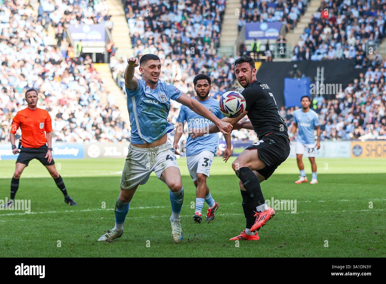 #4, Bobby Thomas of Coventry City battles in the area with #3, Enda ...