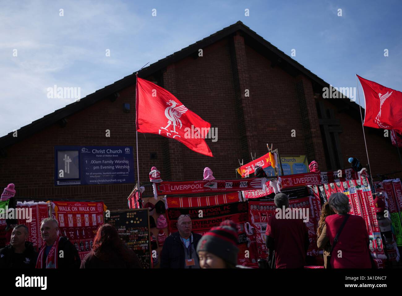 Liverpool fans look at a merchandise stand ahead the English Premier ...