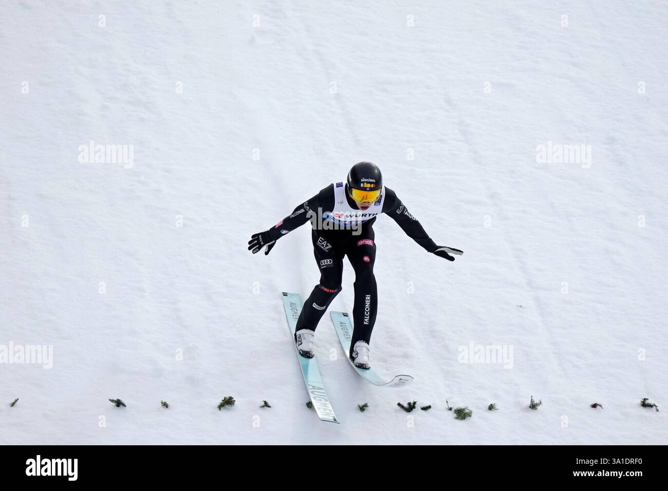 Alex Insam, of Italy, lands his first round jump of the ski jumping men ...
