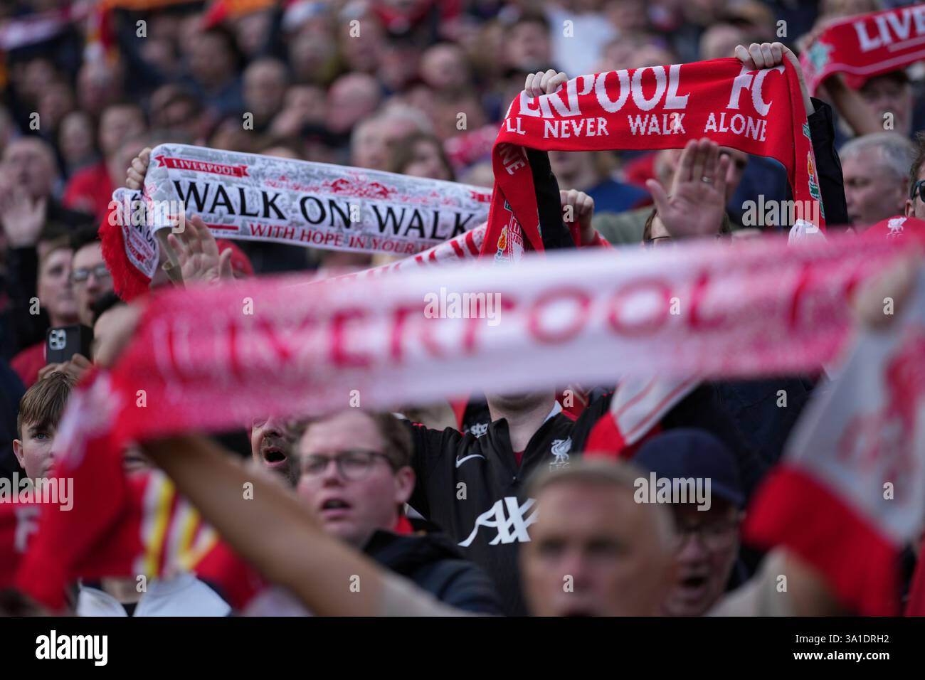 Liverpool fans cheer their team ahead of the English Premier League ...
